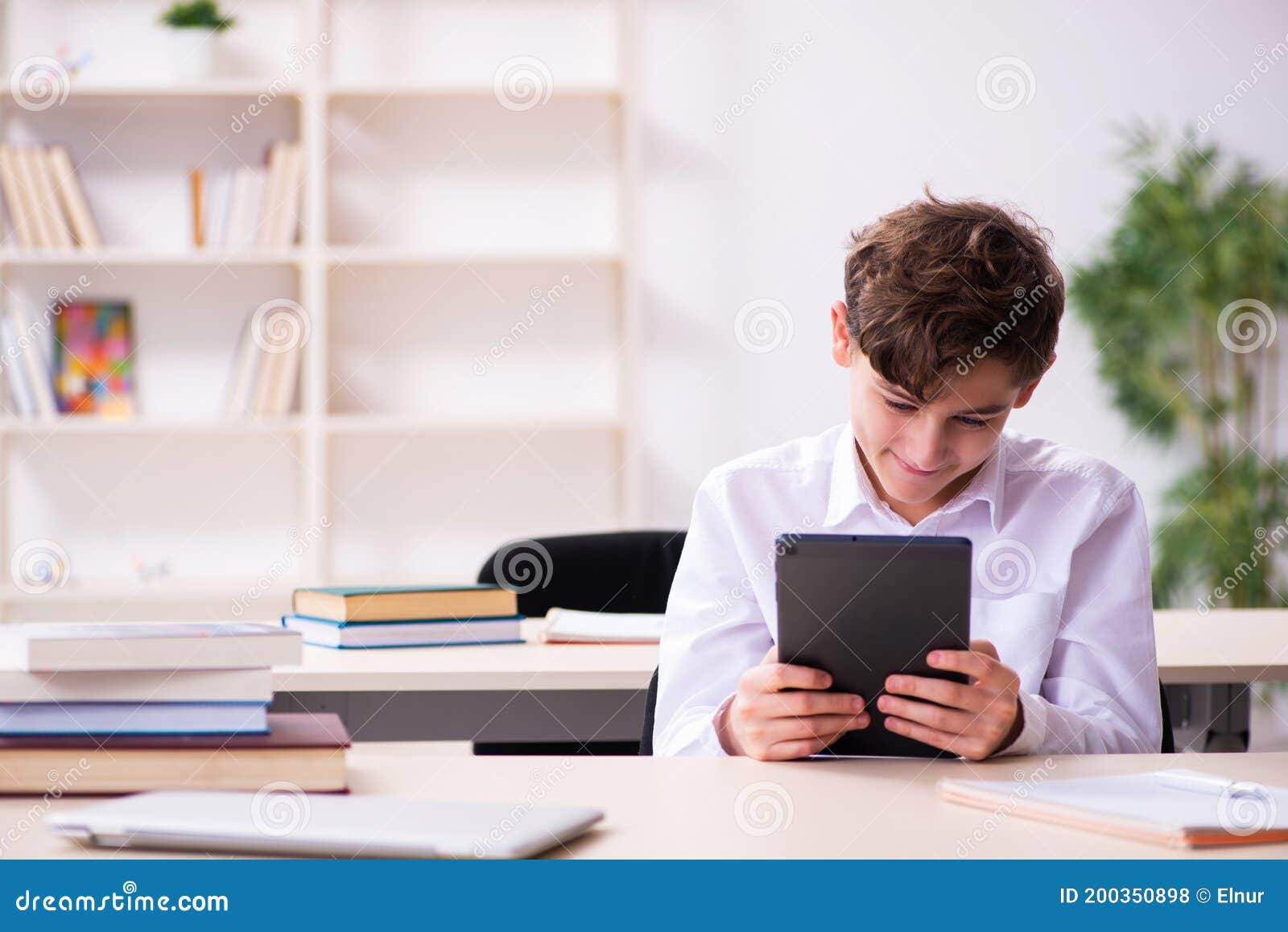 Schoolboy in Tele-education Concept in the Classroom Stock Photo ...