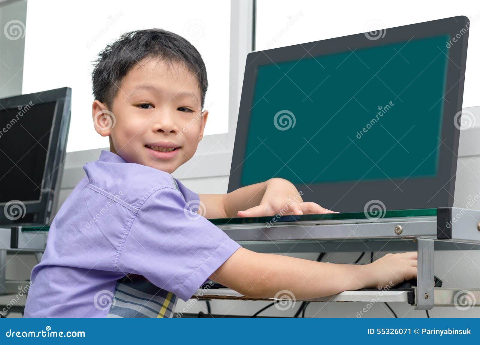 Schoolboy using computer stock image. Image of male, desktop - 55326071