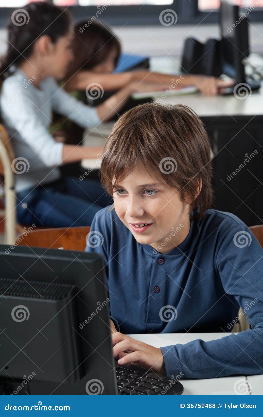 Schoolboy Using Computer at Desk Stock Photo - Image of education ...