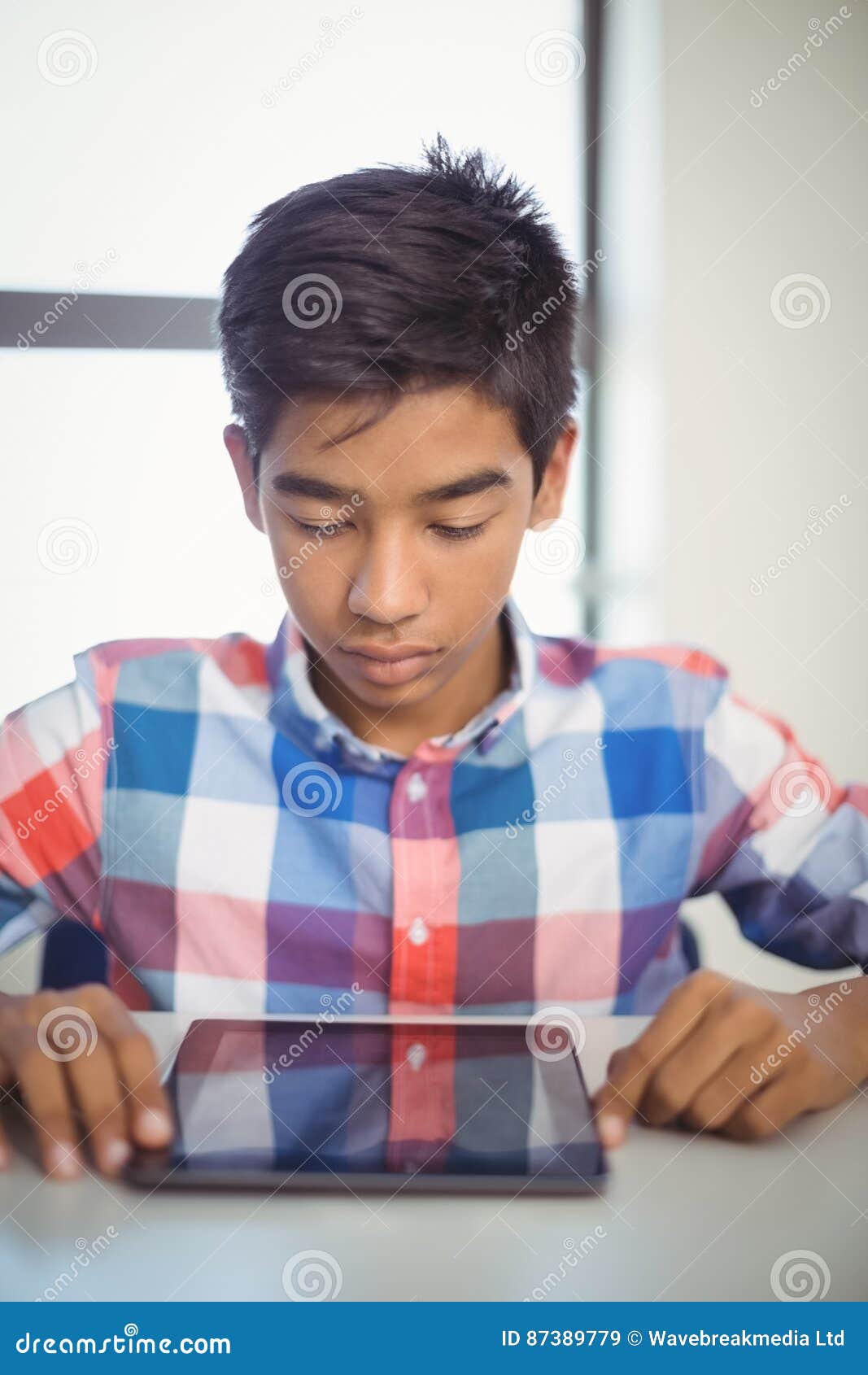 Schoolboy Using Digital Tablet at Desk Stock Image - Image of ...