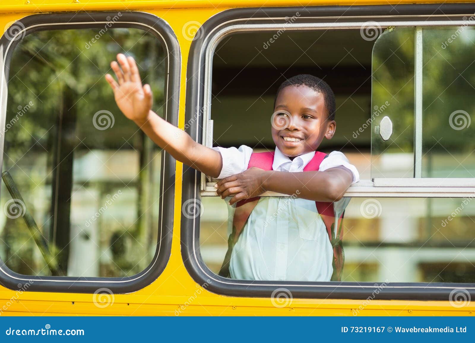 Schoolboy Waving Hand from Bus Stock Image - Image of child, male: 73219167