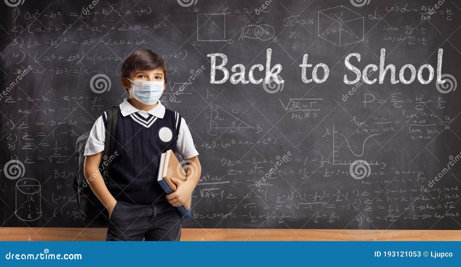 Schoolboy Wearing a Protective Face Mask and Standing in Front of a ...