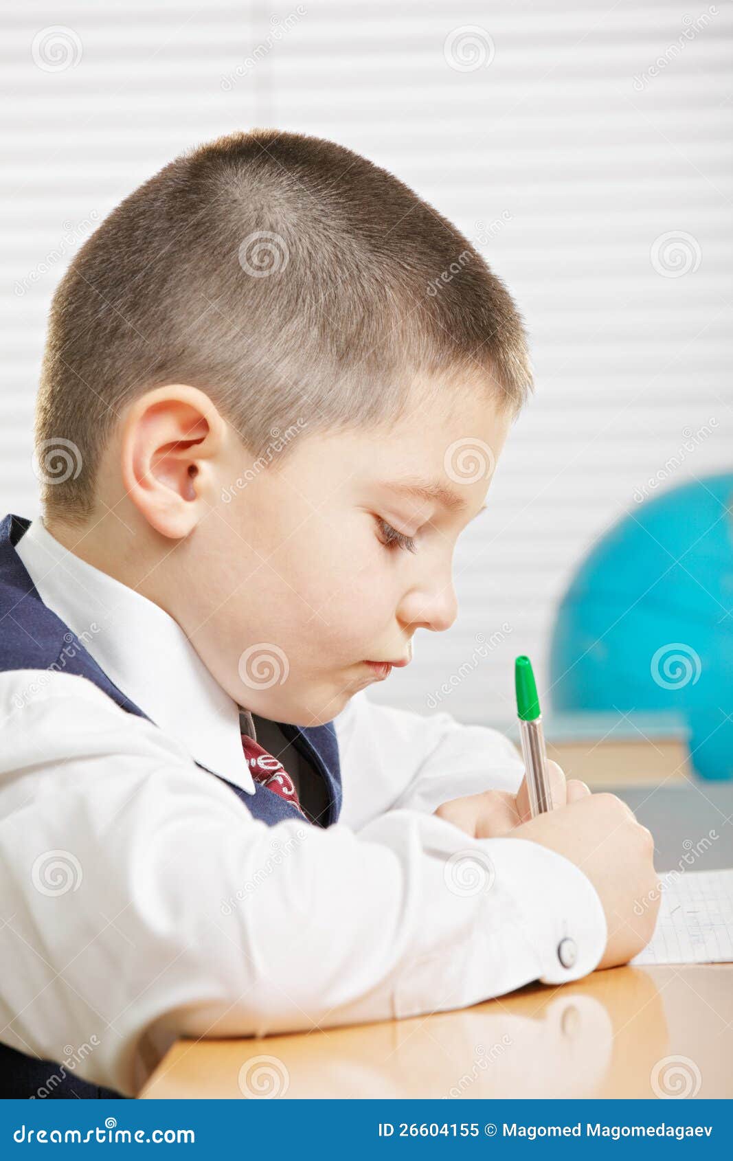 Schoolboy writing stock image. Image of copybook, serious - 26604155