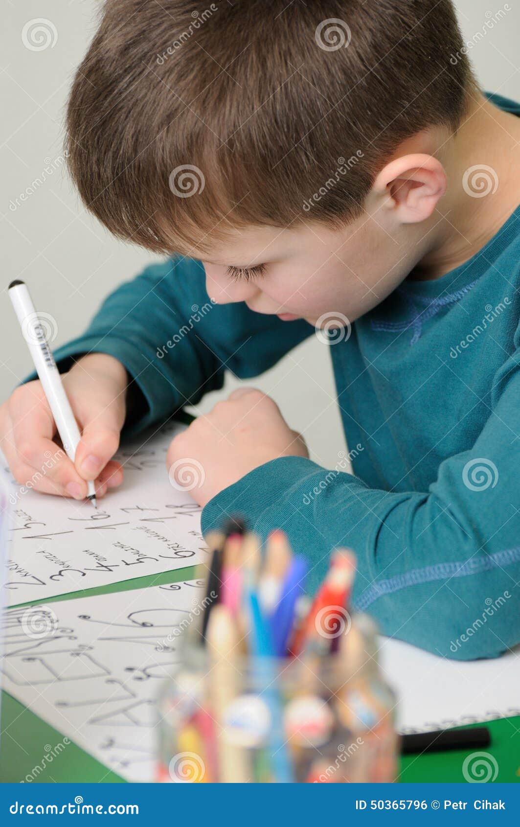 Schoolboy writing stock photo. Image of student, young - 50365796