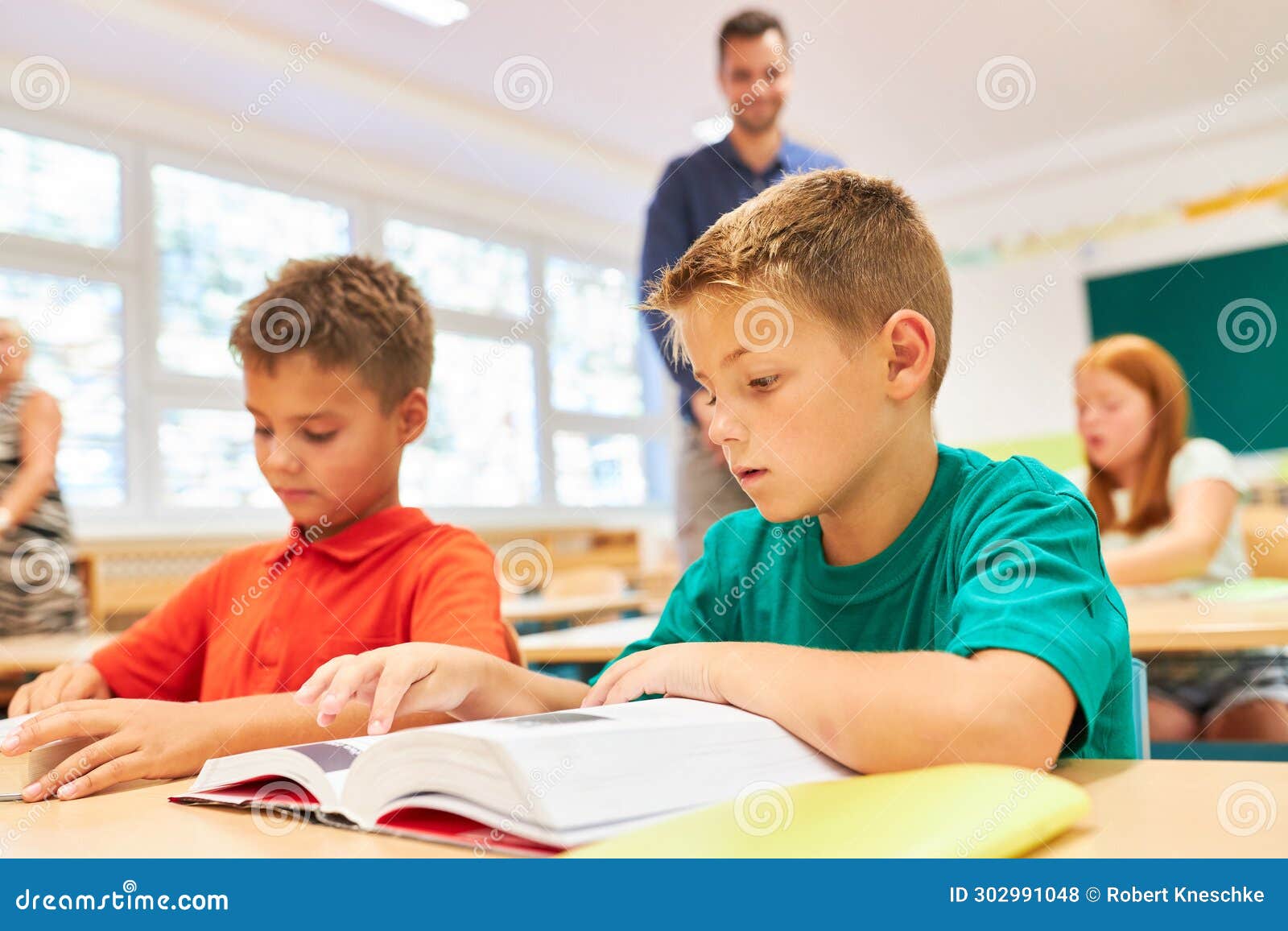 Schoolboys Reading Book in Classroom Stock Photo - Image of knowledge ...