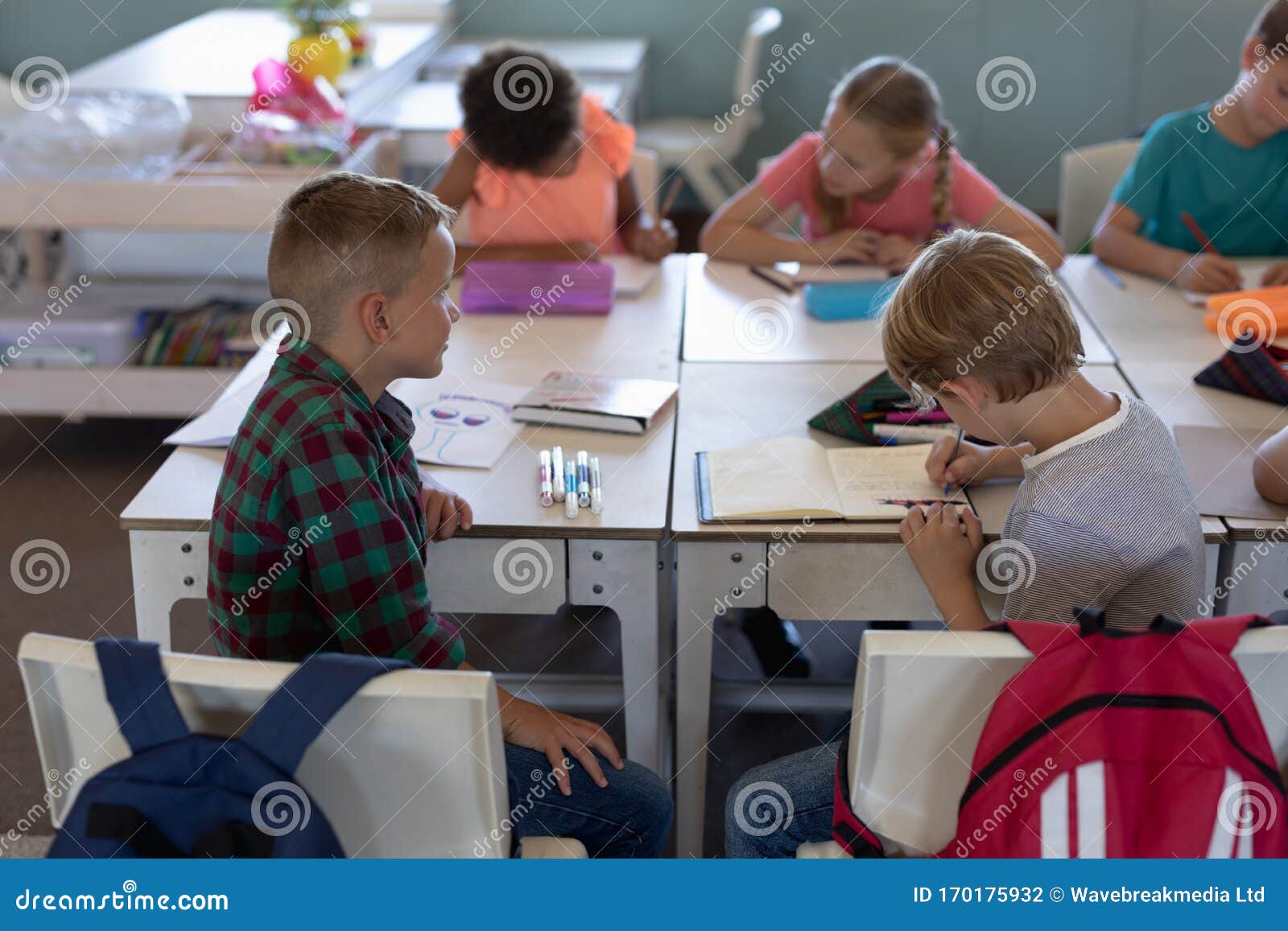Schoolboys Sitting at Desks in an Elementary School Classroom Stock ...