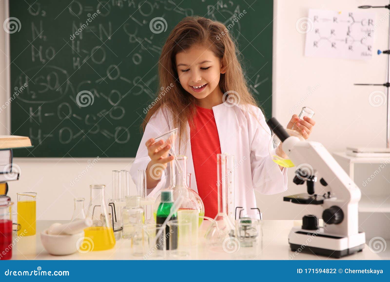 Schoolchild Making Experiment at Table in Class Stock Photo - Image of ...