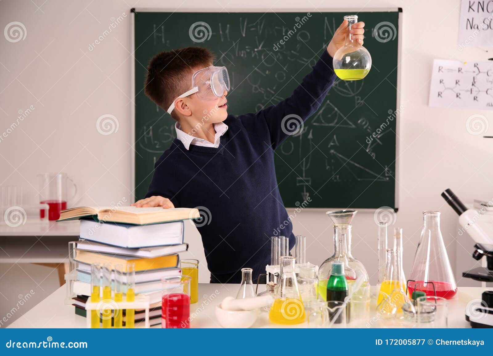 Schoolchild Making Experiment at Table in Class Stock Image - Image of ...