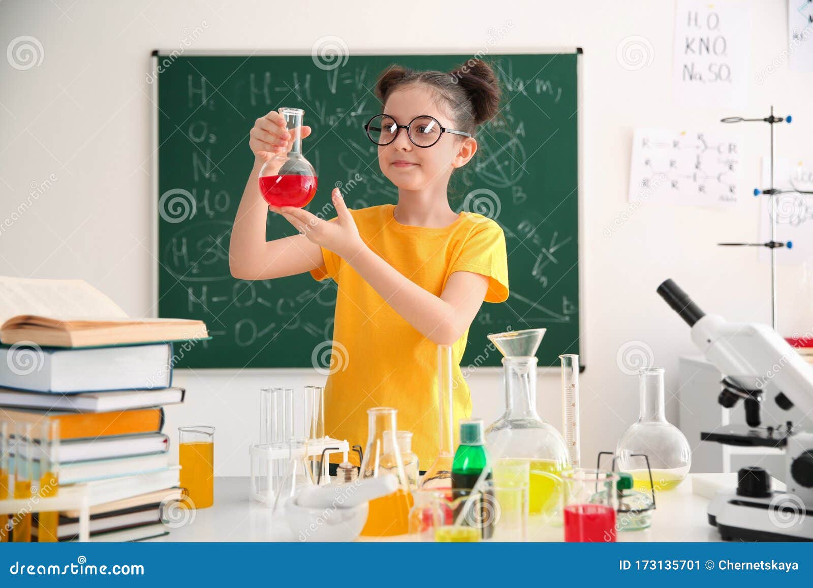 Schoolchild Making Experiment at Table in Class Stock Image - Image of ...