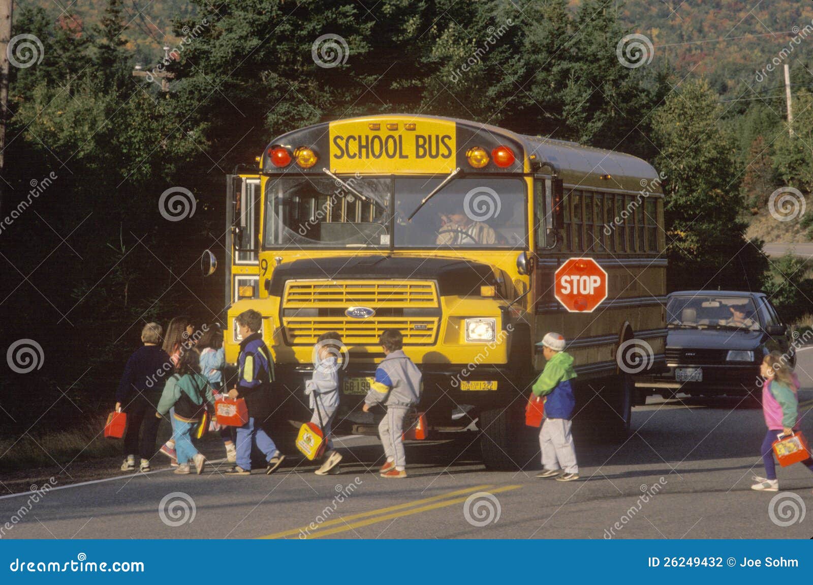 Schoolchildren Boarding a Schoolbus Editorial Photography - Image of ...