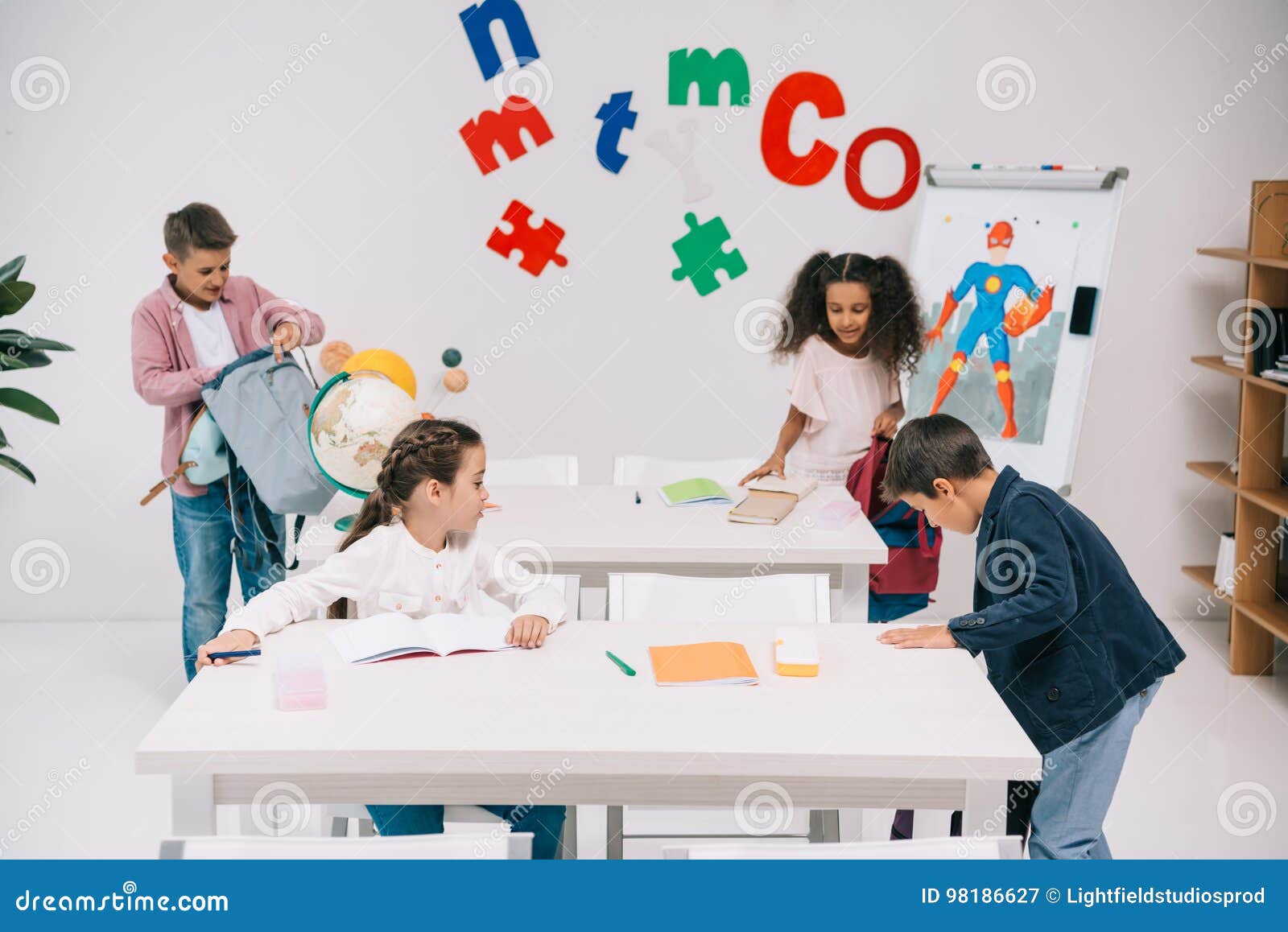 Schoolchildren Preparing for Lesson in Classroom Stock Image - Image of ...