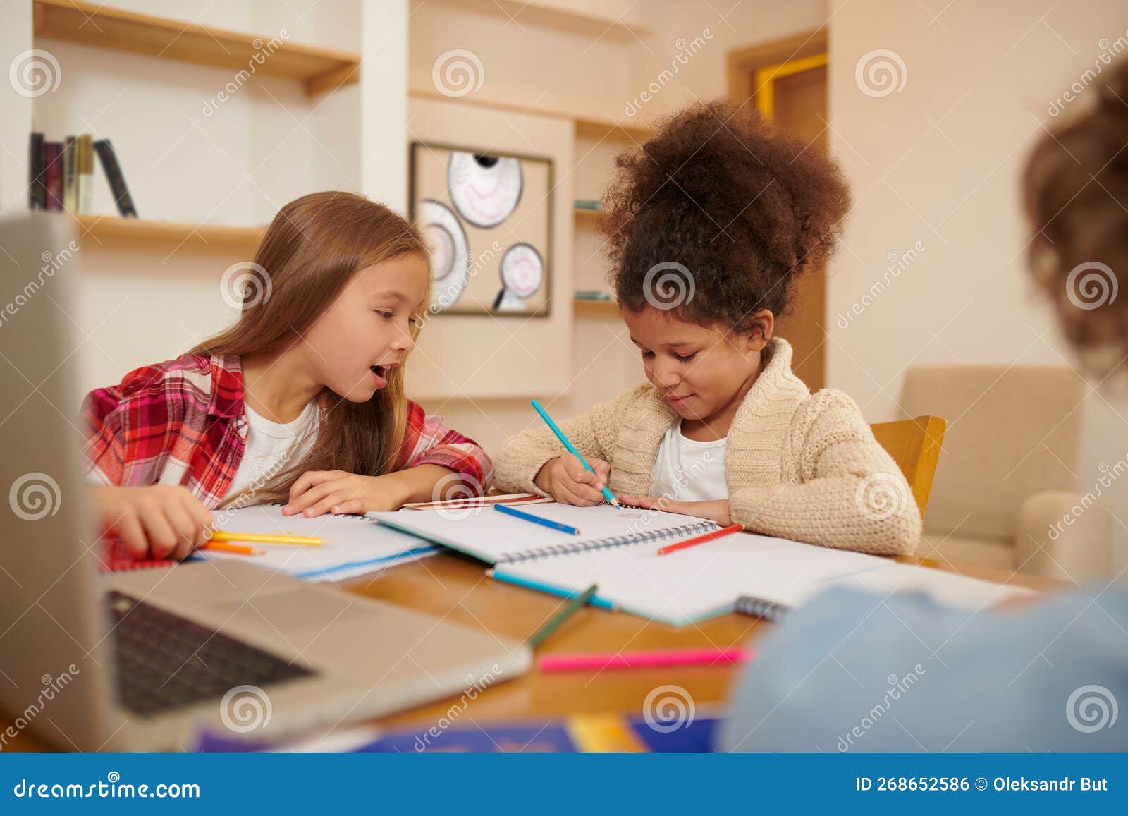 Schoolchildren Preparing Lessons Together and Discussing the Tasks ...