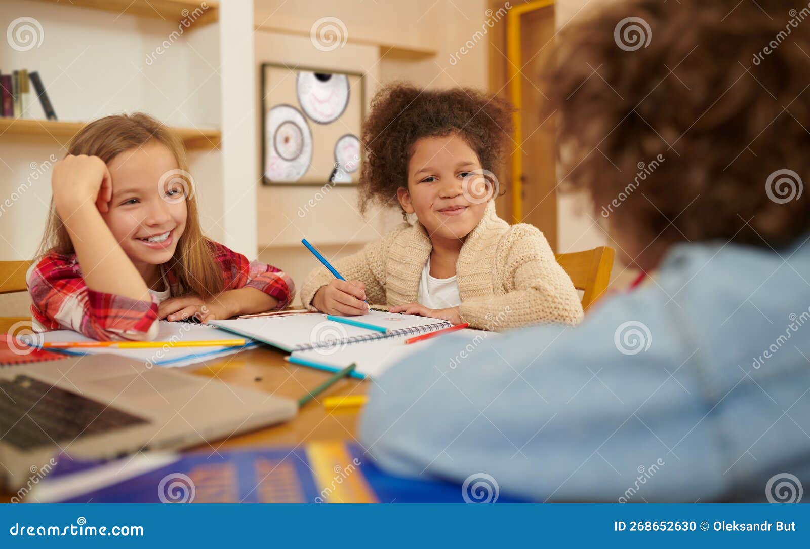 Schoolchildren Preparing Lessons Together and Discussing the Tasks ...