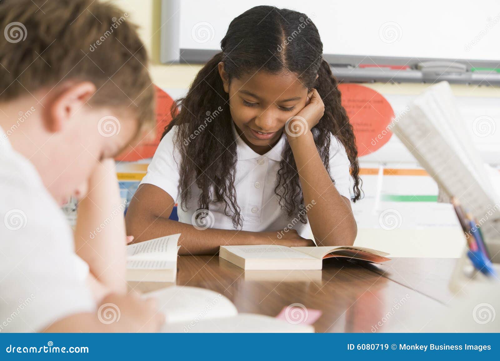 Schoolchildren Reading Books in Class Stock Image - Image of colour ...