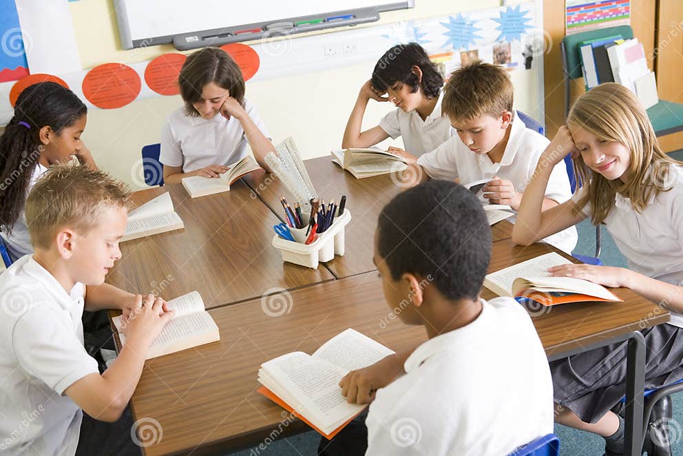 Schoolchildren Reading Books in Class Stock Photo - Image of group ...