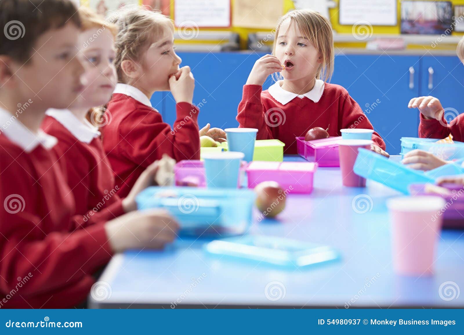 Schoolchildren Sitting at Table Eating Packed Lunch Stock Image - Image ...