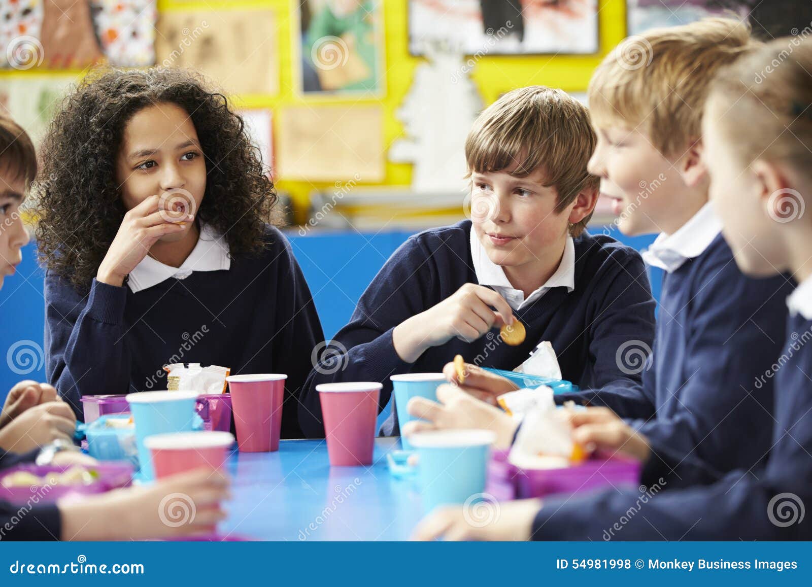 Schoolchildren Sitting at Table Eating Packed Lunch Stock Photo - Image ...