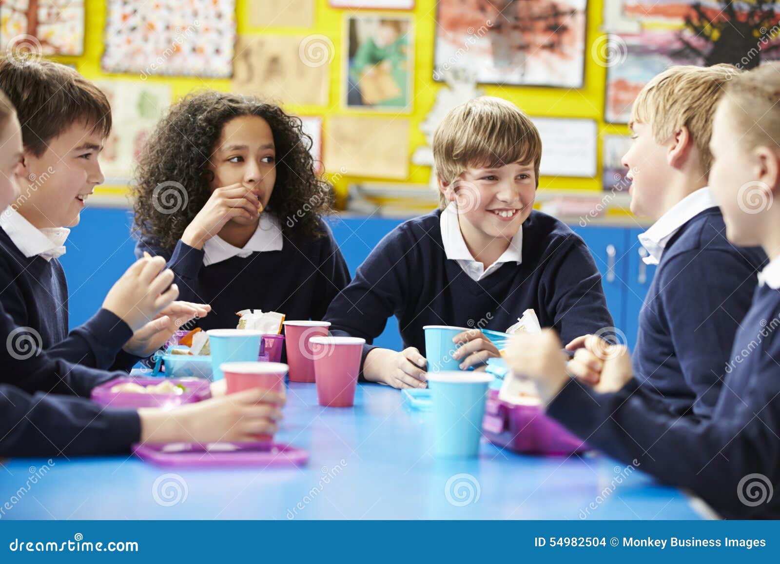 Schoolchildren Sitting at Table Eating Packed Lunch Stock Photo - Image ...