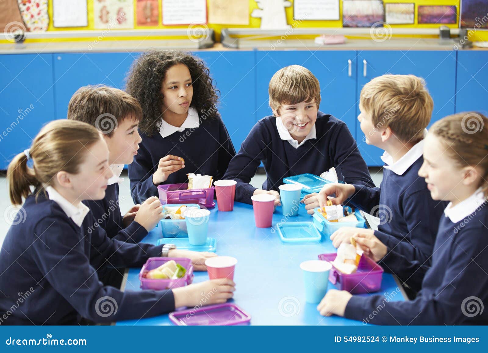 Schoolchildren Sitting at Table Eating Packed Lunch Stock Photo - Image ...