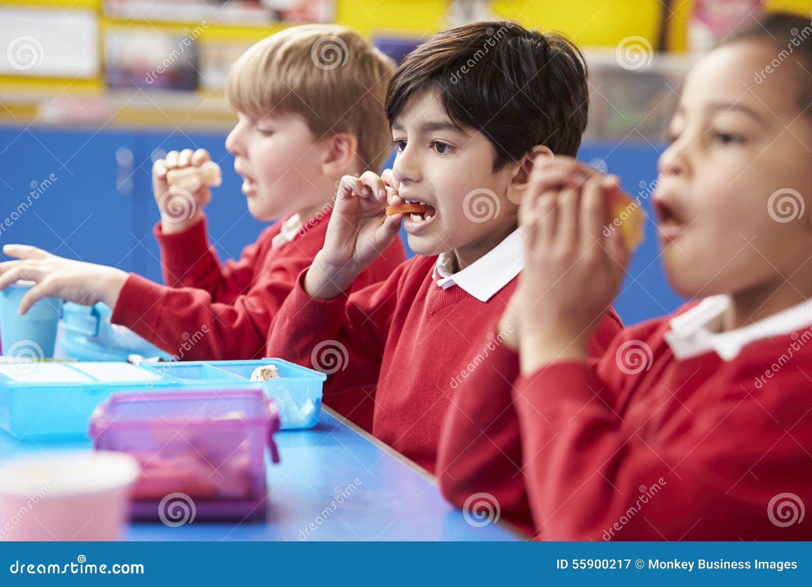 Schoolchildren Sitting at Table Eating Packed Lunch Stock Image - Image ...