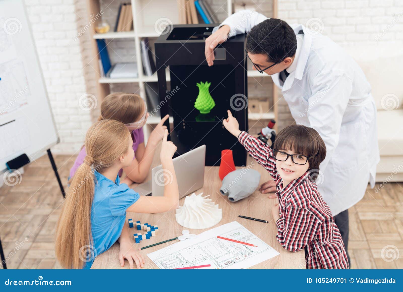 Children Print Different Items on a 3d Printer with a Teacher. Stock ...