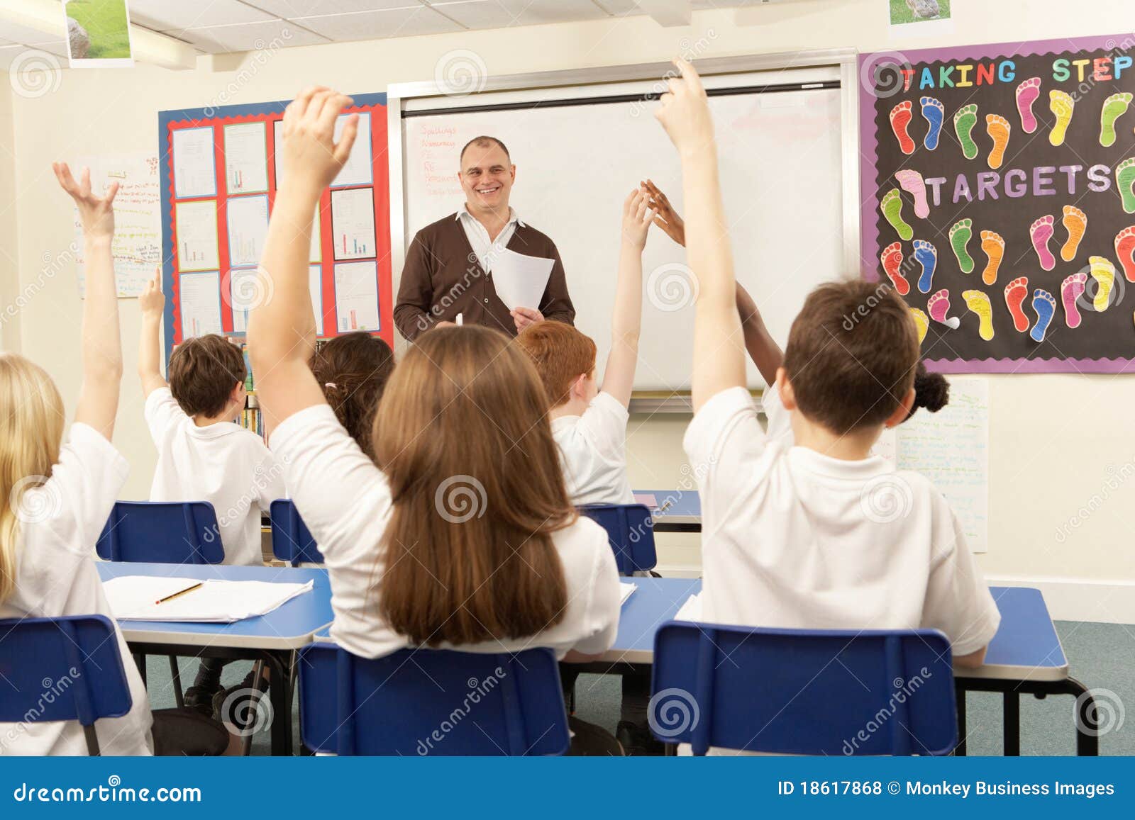 Schoolchildren Studying in Classroom Stock Photo - Image of assisting ...