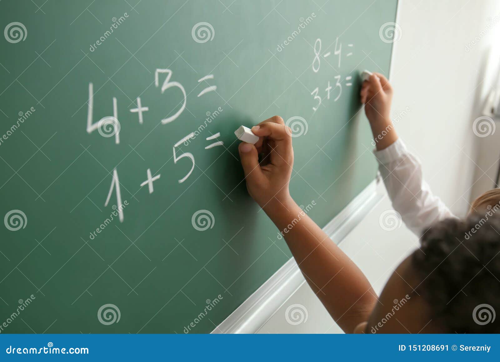 Schoolchildren Writing on Chalkboard in Classroom during Math Lesson ...