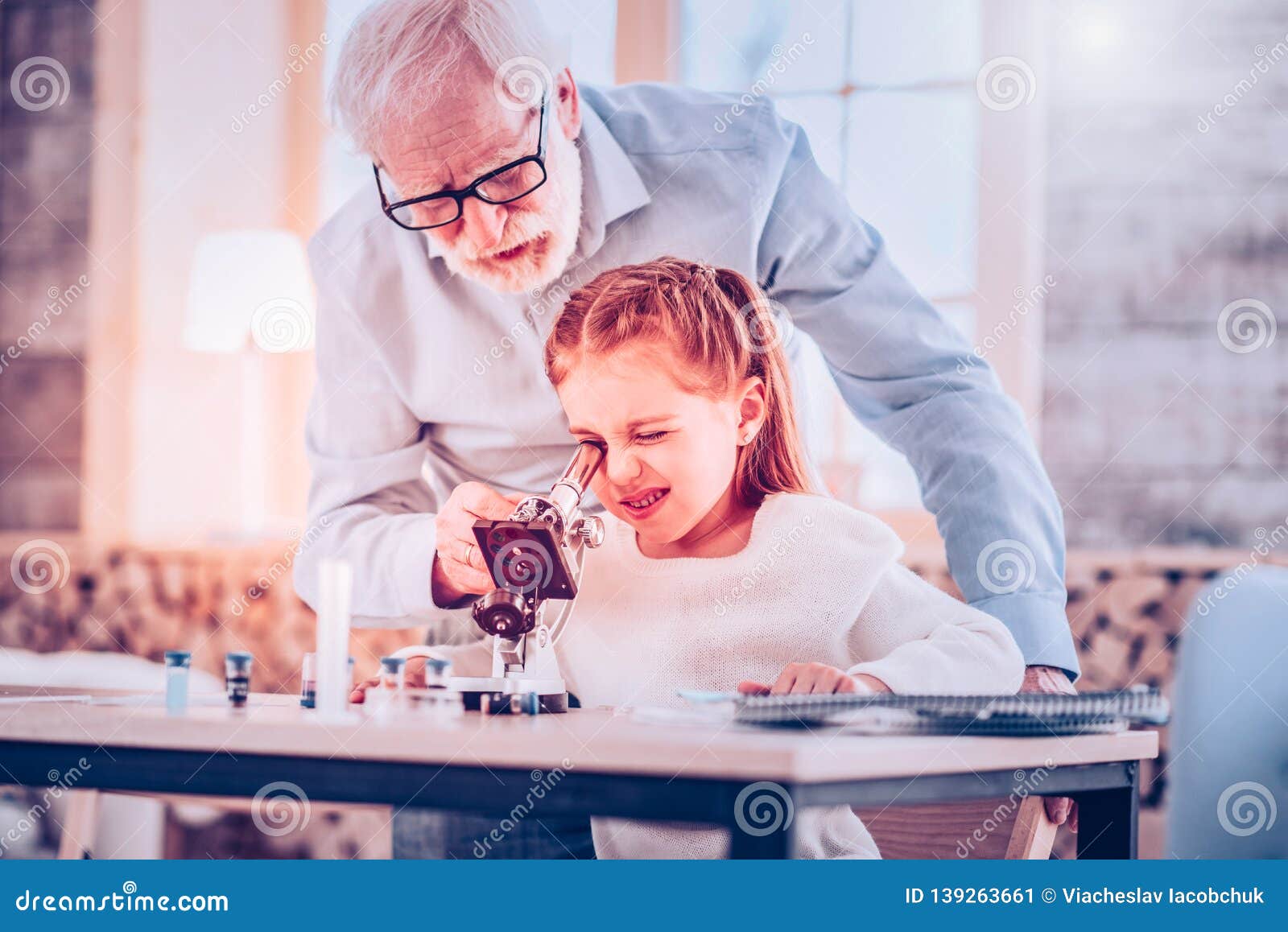 Schooler Blinking while Using Microscope Sitting at Desk Stock Image ...