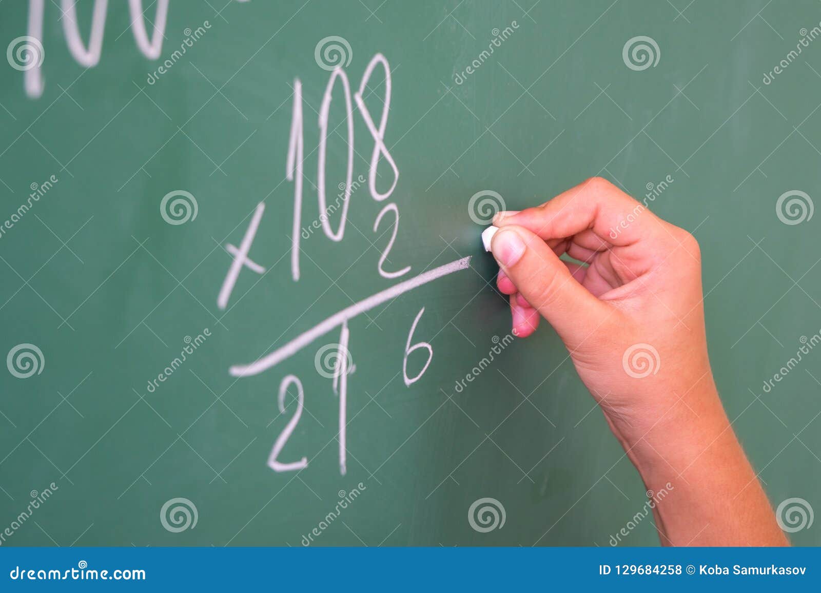 Schoolgirl with Chalk at the Blackboard Solves a Math Problem Stock ...