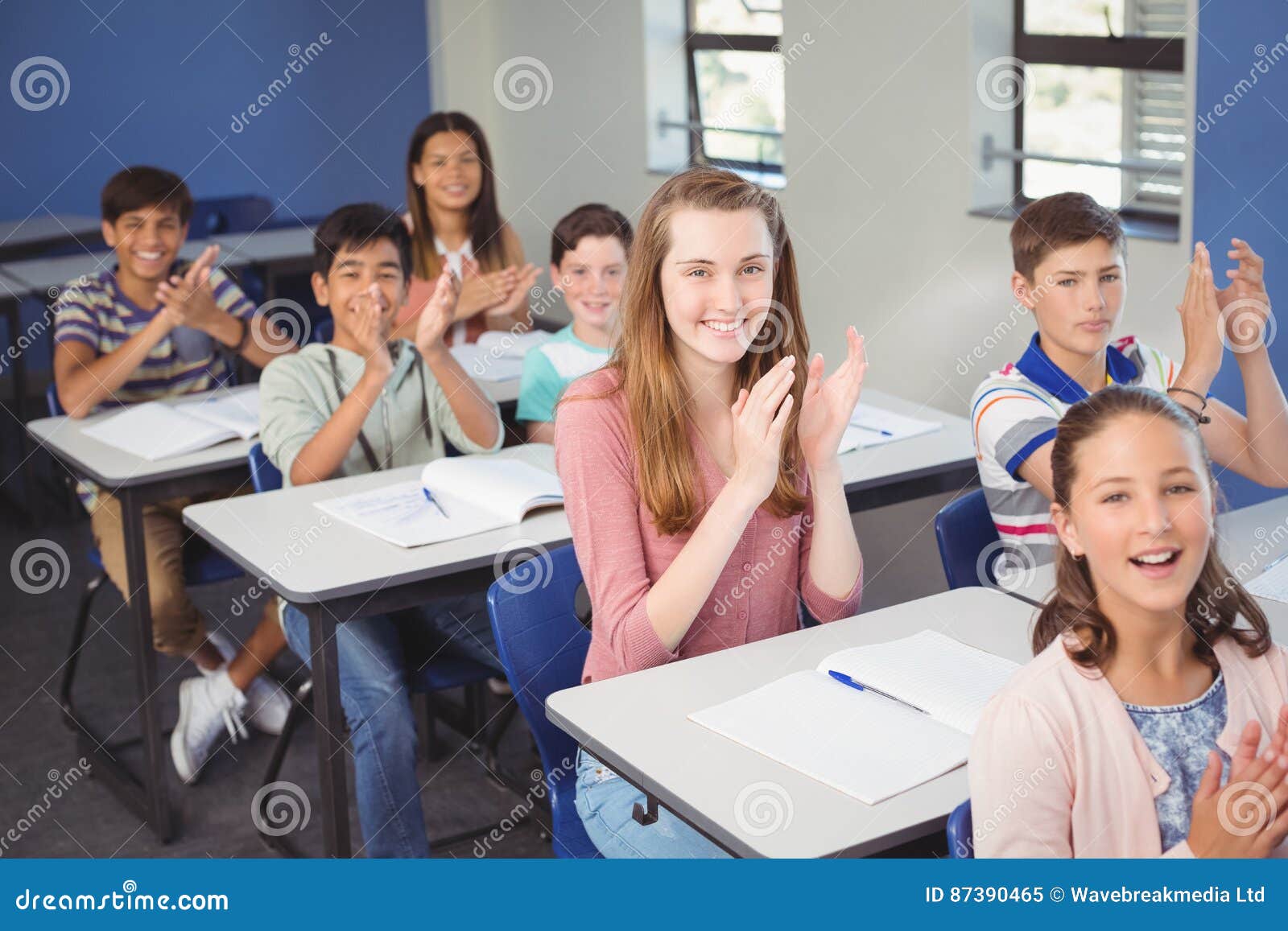 Schoolgirl Clapping Hands in Classroom at School Stock Image - Image of ...