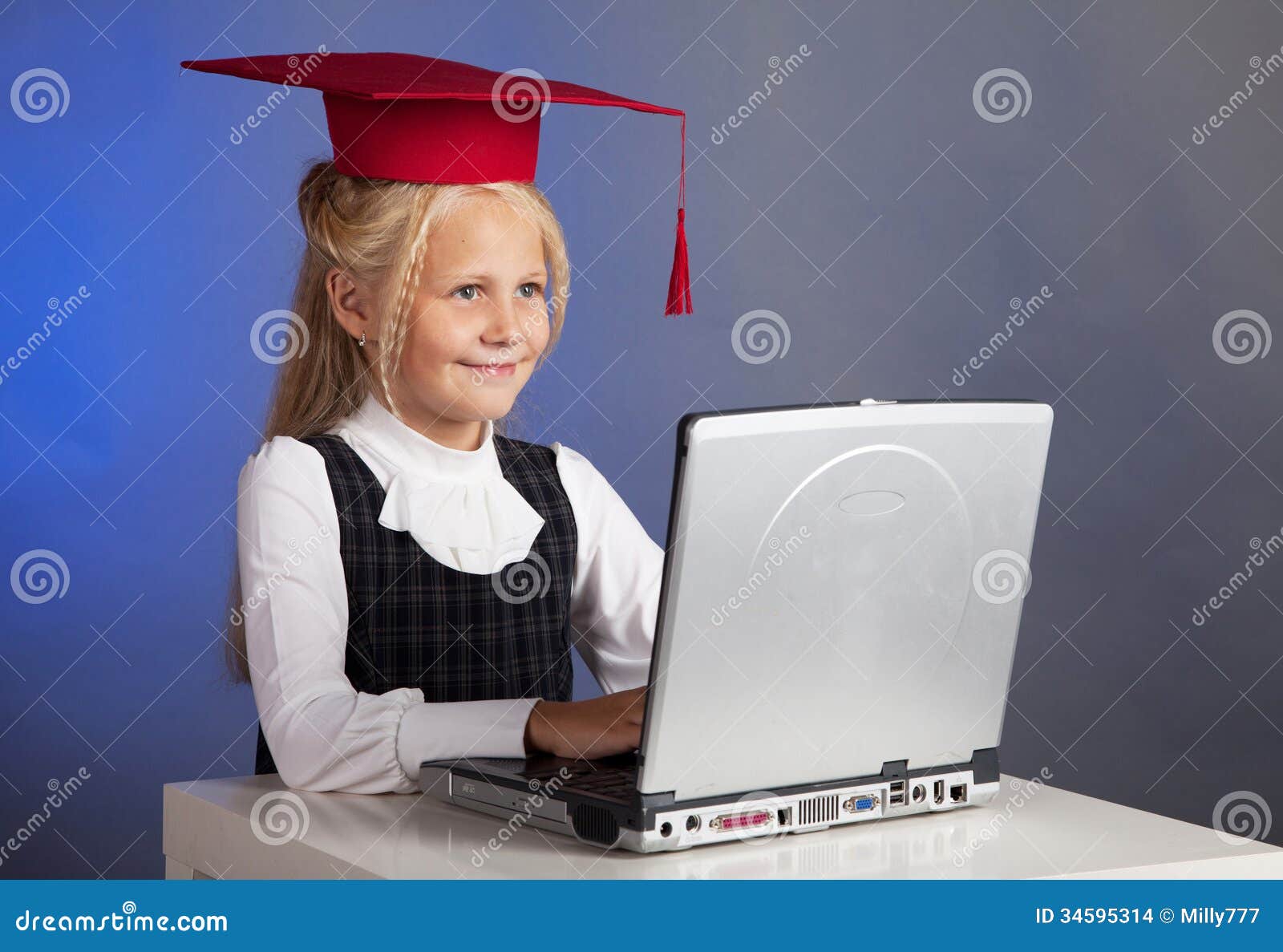School Girl in a Red Hat, Working on a Computer. Stock Photo - Image of ...
