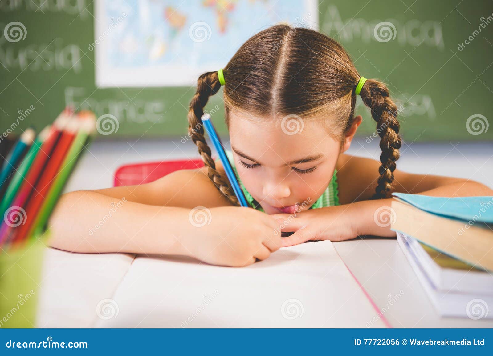 Schoolgirl Doing Homework in Classroom Stock Photo - Image of caucasian ...
