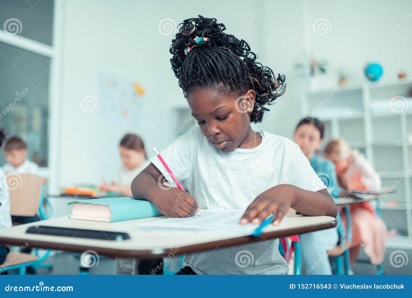 Schoolgirl Doing Sums with Concentrated Face at the Test . Stock Image ...