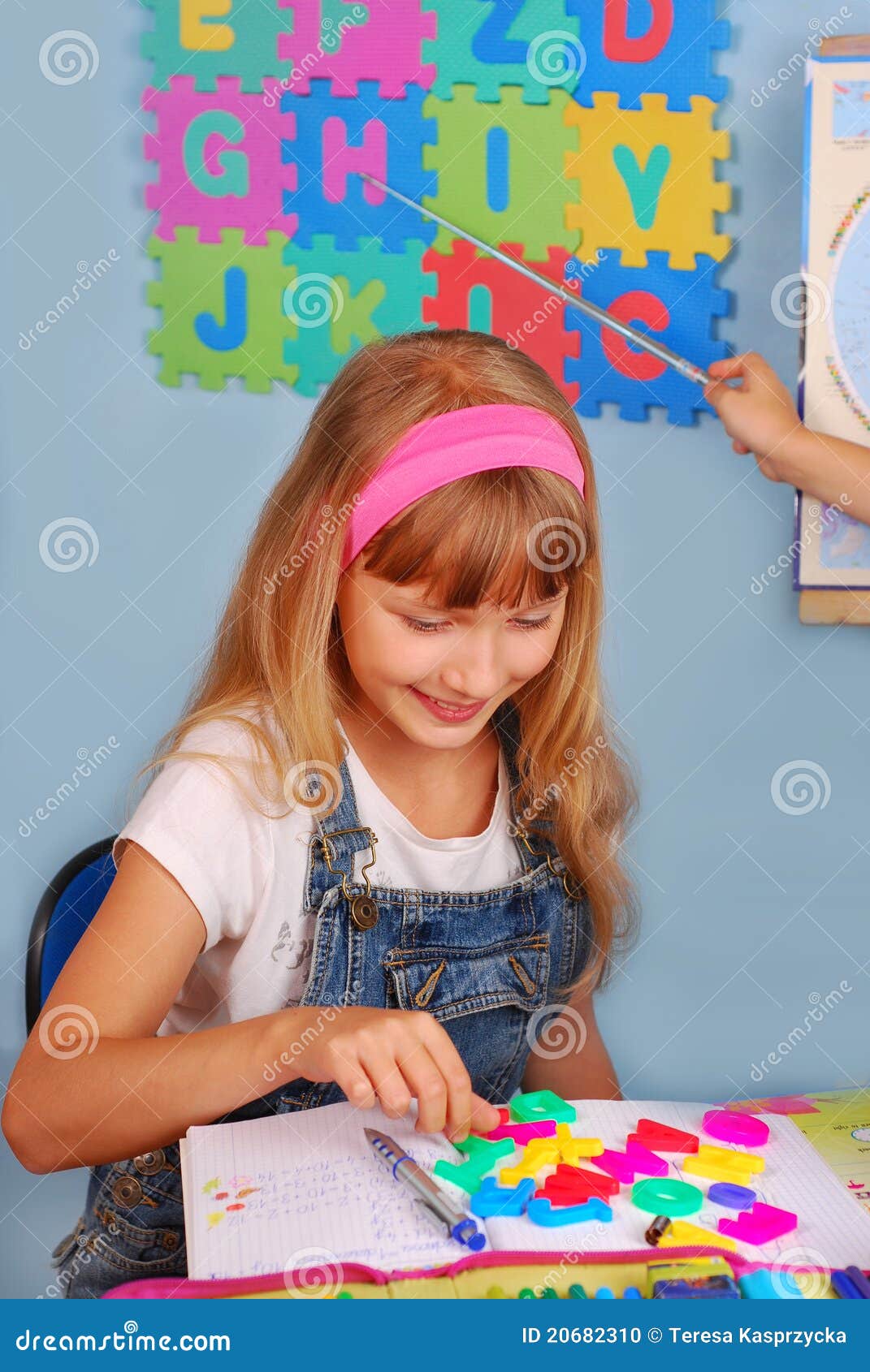 Schoolgirl Learning Letters Stock Photo - Image of learn, hand: 20682310