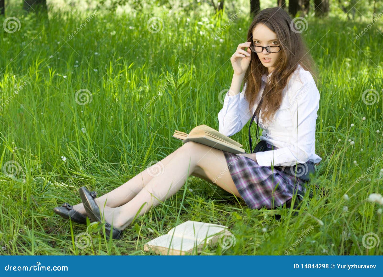 Schoolgirl in Park Read Book Stock Photo - Image of meadow, outdoors ...