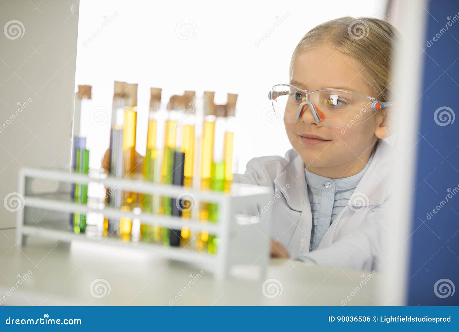 Schoolgirl in Protective Goggles Looking at Test Tubes Stock Photo ...