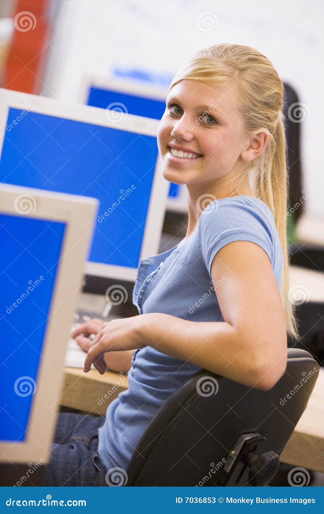 Schoolgirl Sitting in Front of a Computer Stock Image - Image of ...