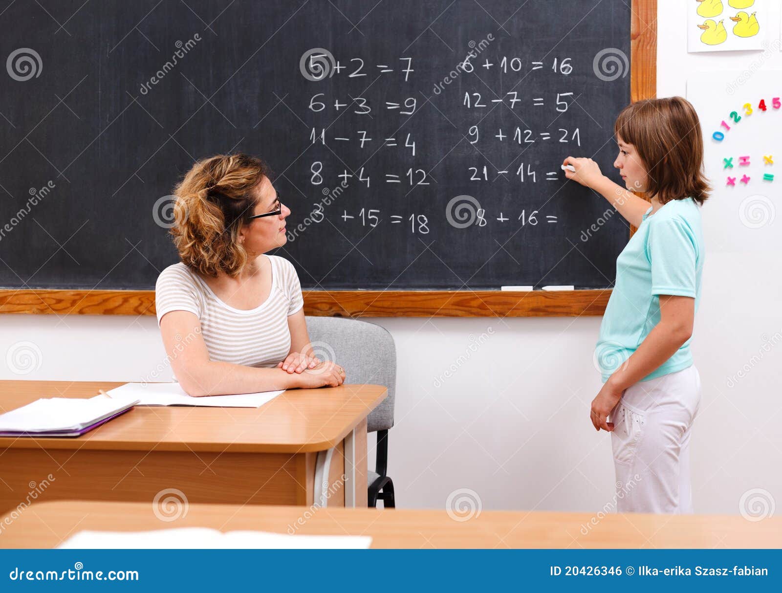 Schoolgirl Solving Math Equations at Chalkboard Stock Photo - Image of ...