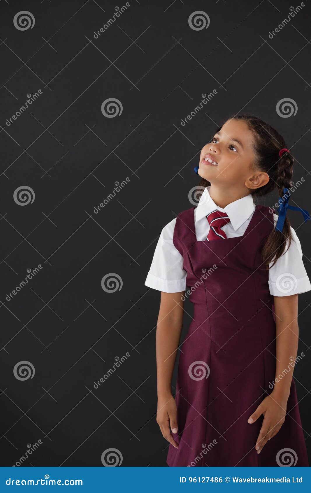 Schoolgirl Standing Against Blackboard in Classroom Stock Photo - Image ...