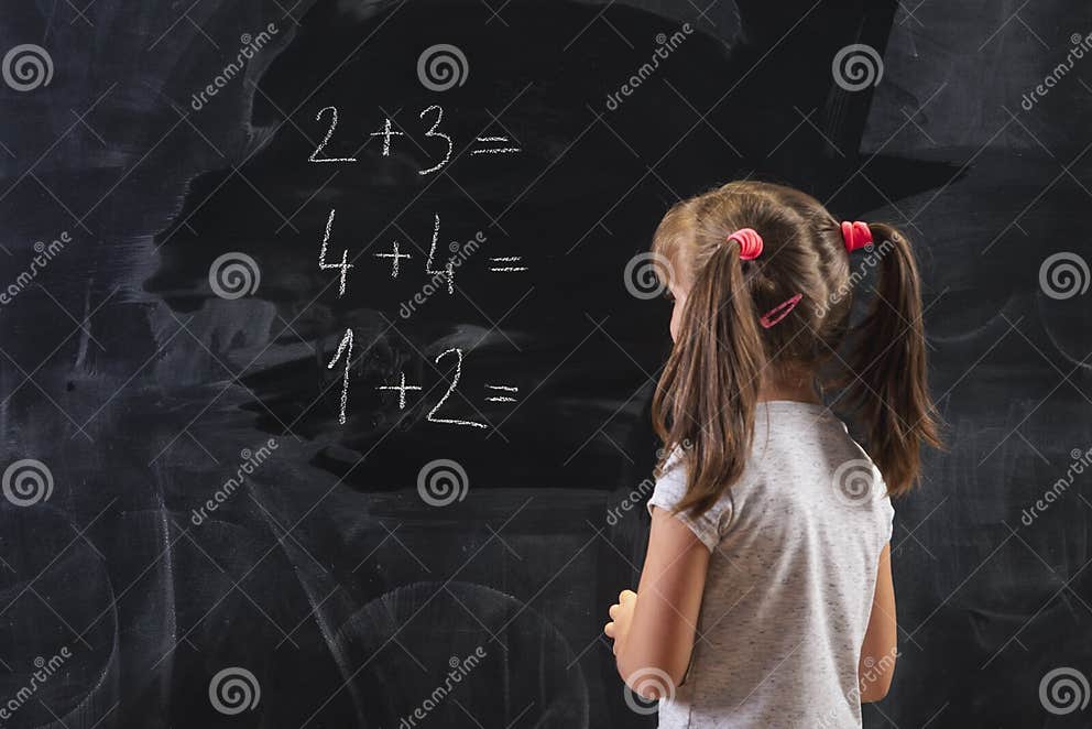 Schoolgirl Solving Math Problems Stock Image - Image of happy, child ...