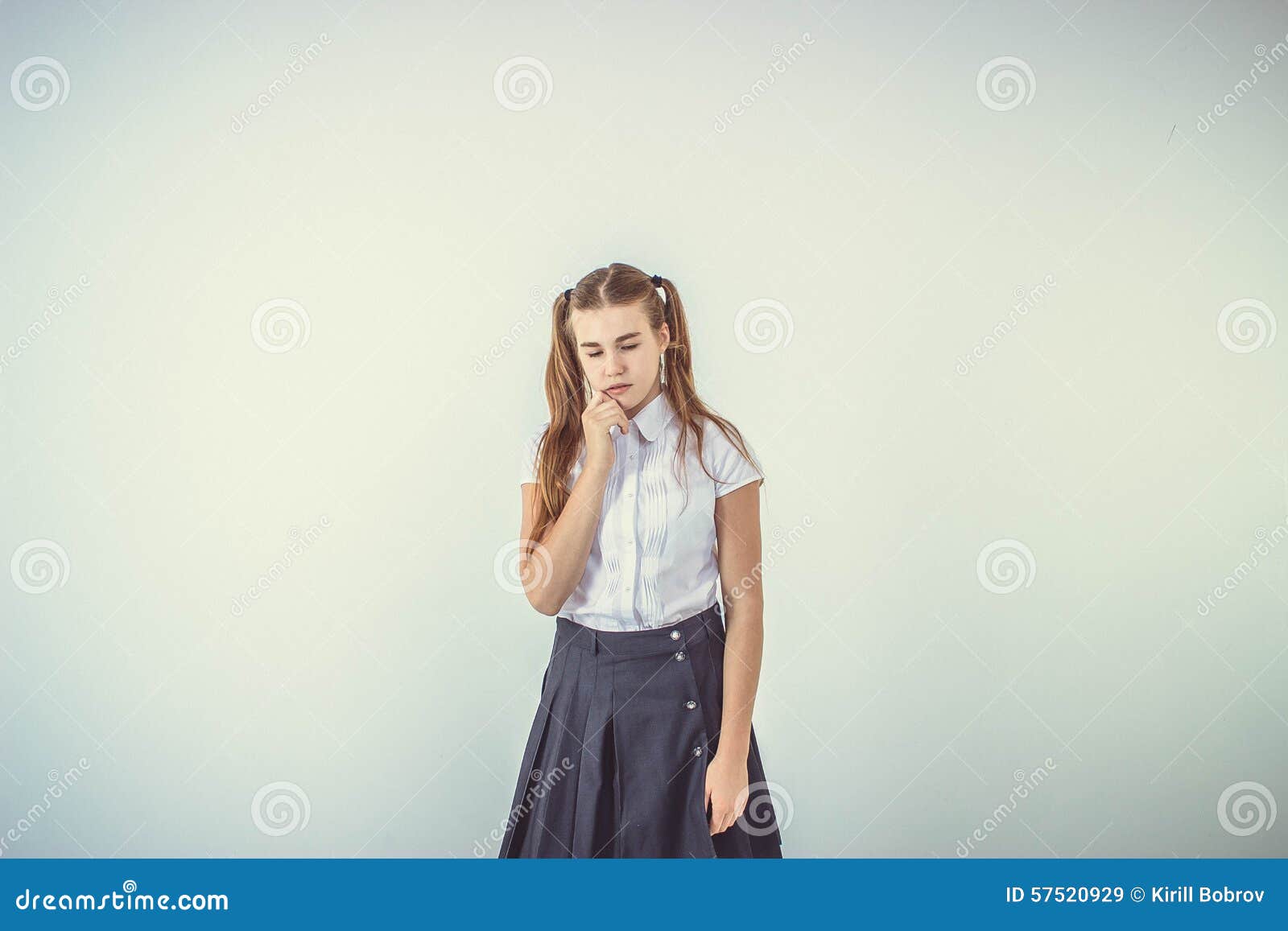 Schoolgirl thinking stock image. Image of smile, hand - 57520929
