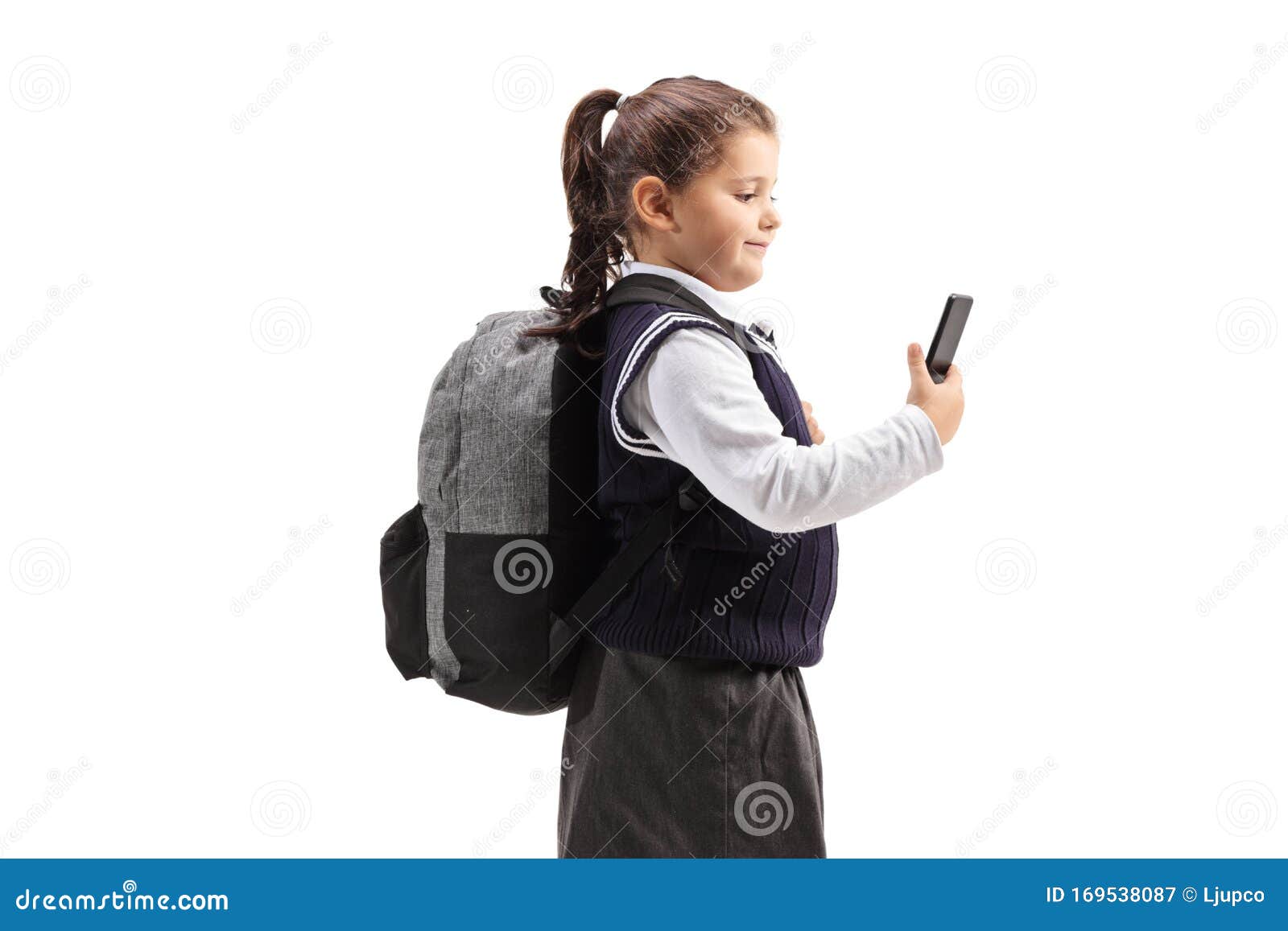 Schoolgirl in a Uniform Using a Mobile Phone 库存图片 - 图片 包括有 藏品, 突出 ...