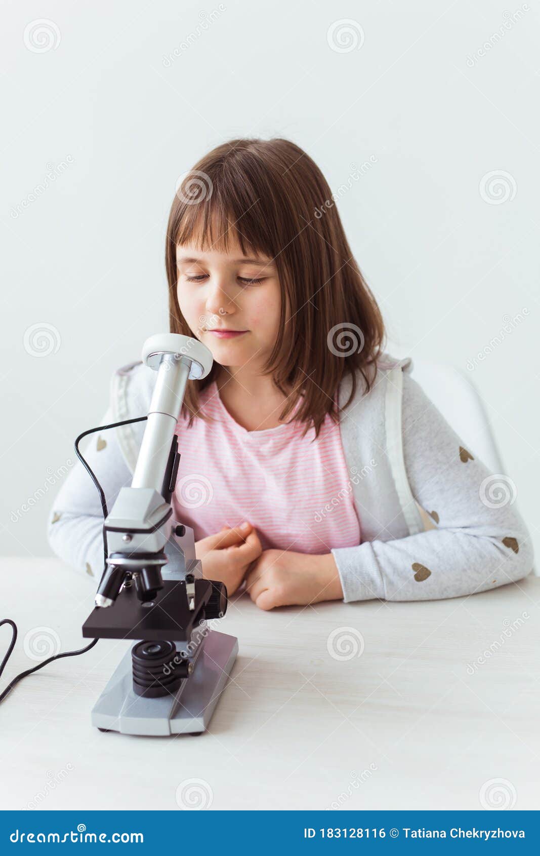Schoolgirl Using Microscope in Science Class. Technologies, Lessons and ...