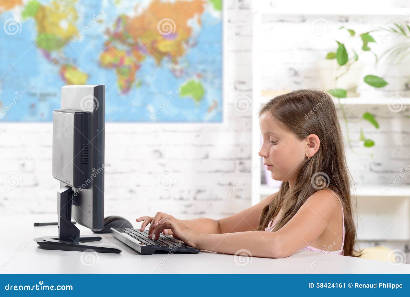 A Schoolgirl Working on a Computer Stock Image - Image of classroom ...
