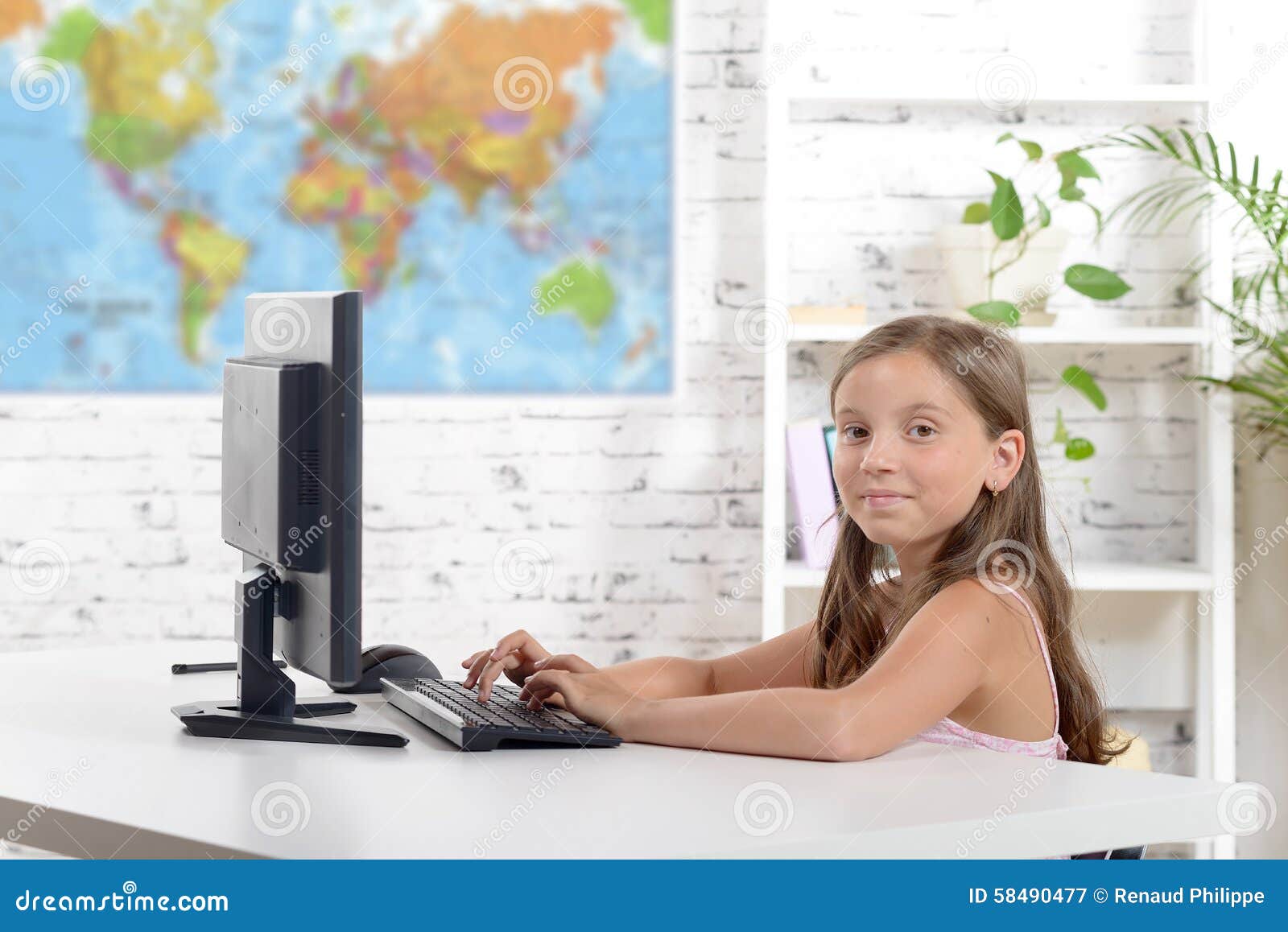 A Schoolgirl Working on a Computer Stock Image - Image of desk, girl ...