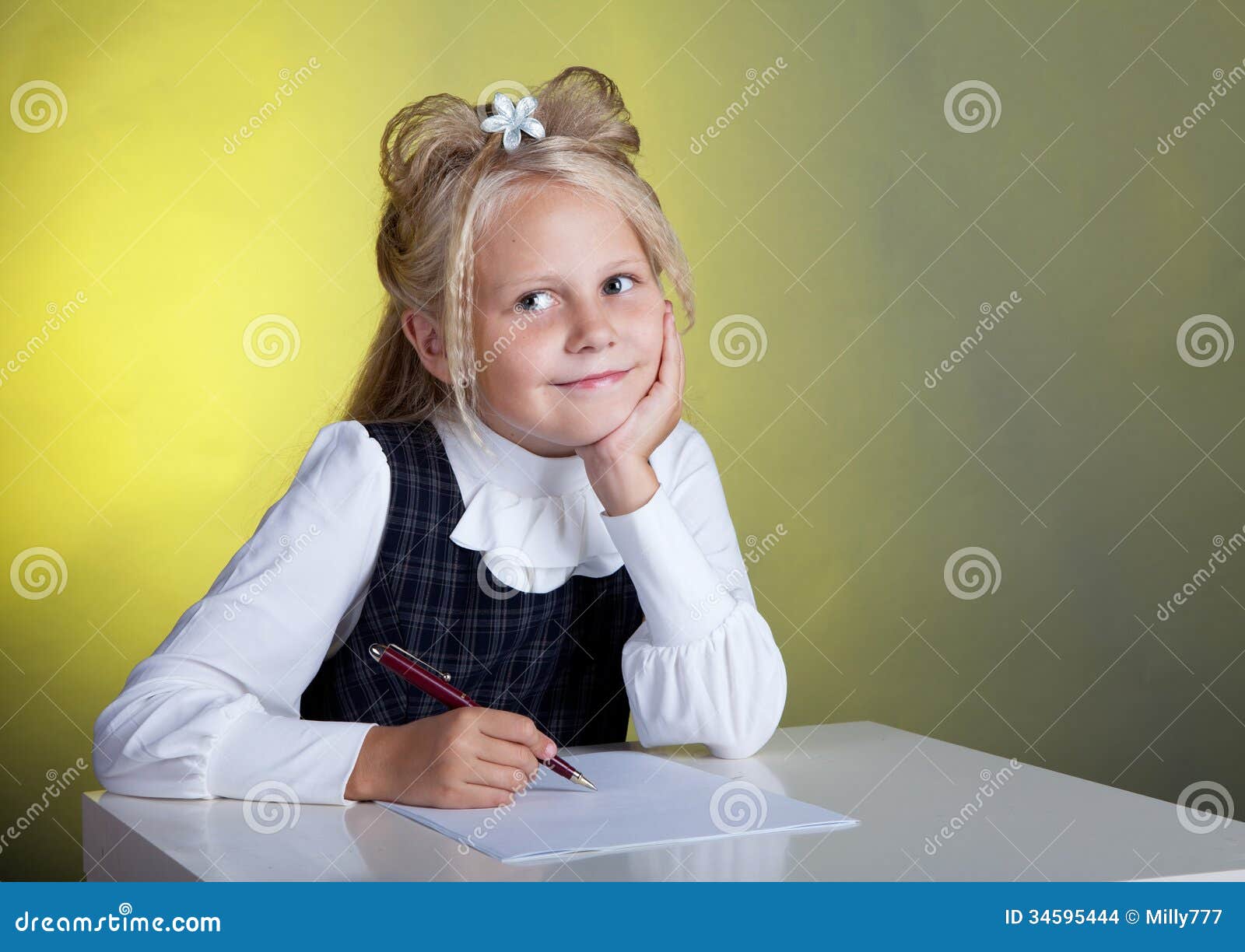 Schoolgirl in School Uniform Writing at the Table. Stock Photo - Image ...
