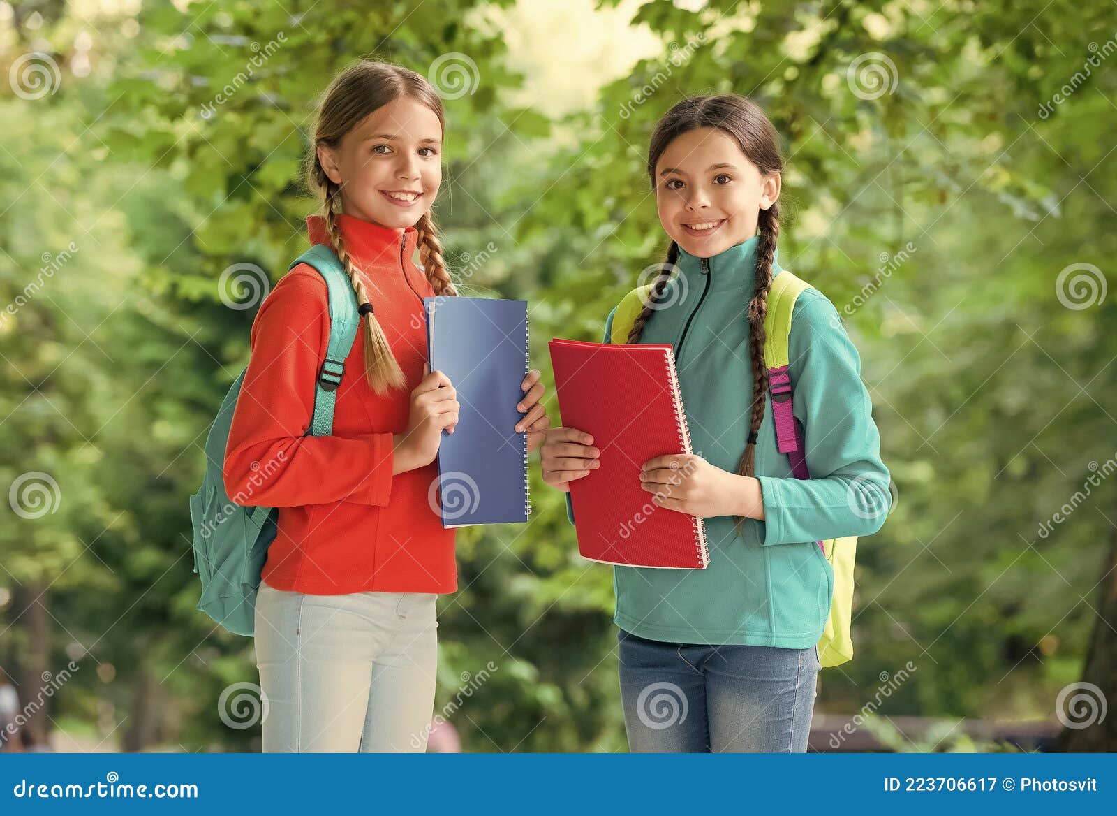 Schoolgirls with Backpacks and Textbooks in Forest, Exploring Nature ...