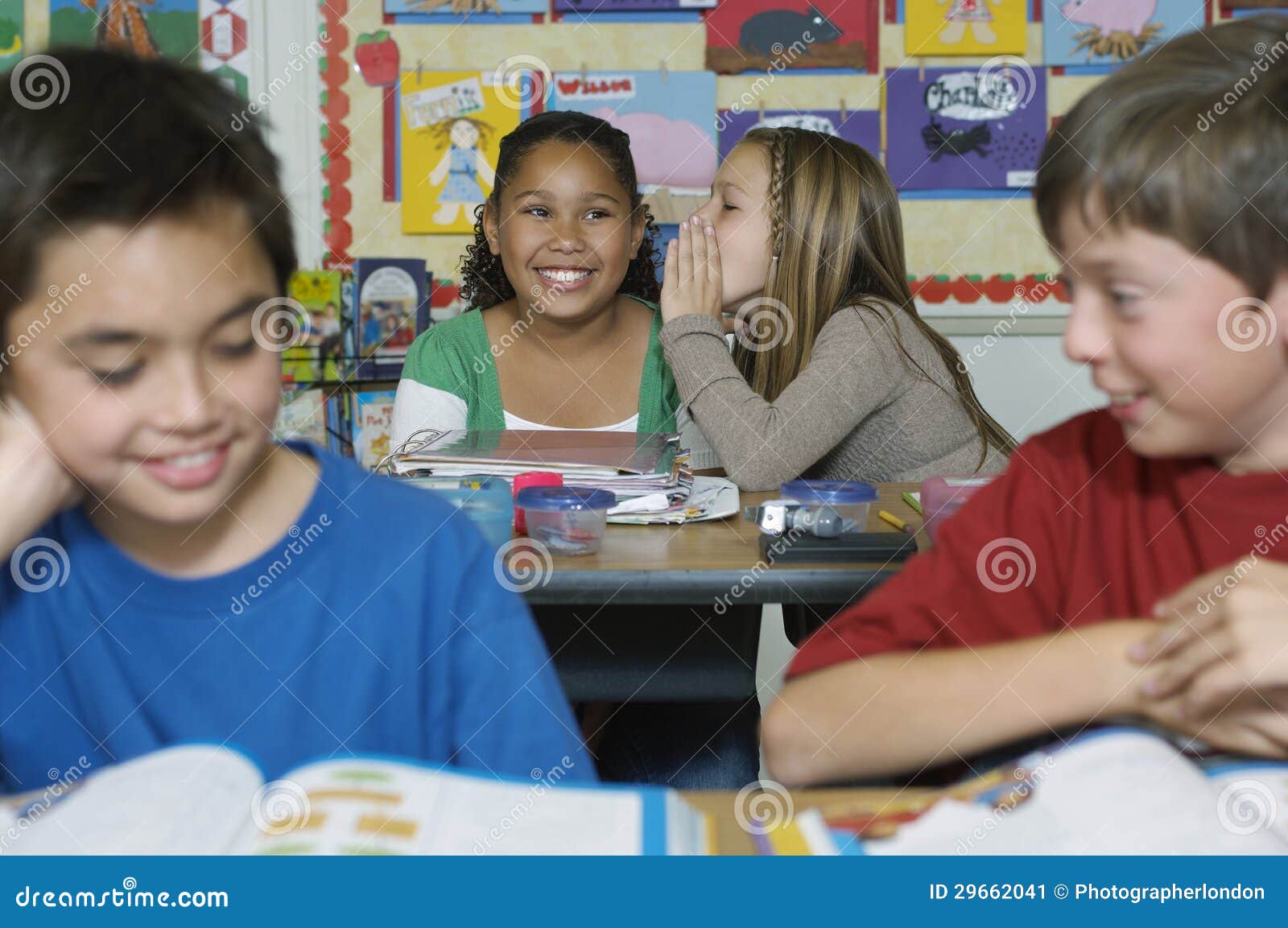Schoolgirls Chatting in Classroom Stock Image - Image of casual, gossip ...