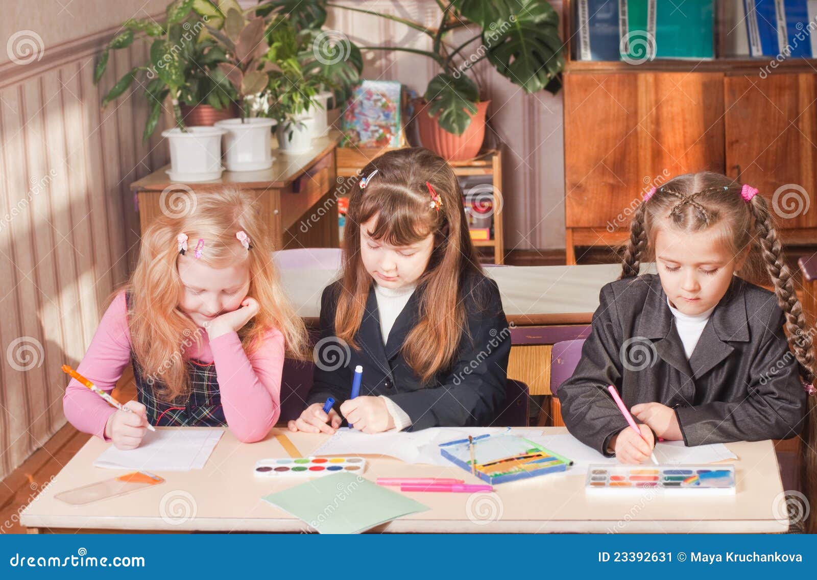 Schoolgirls in classroom stock image. Image of education - 23392631