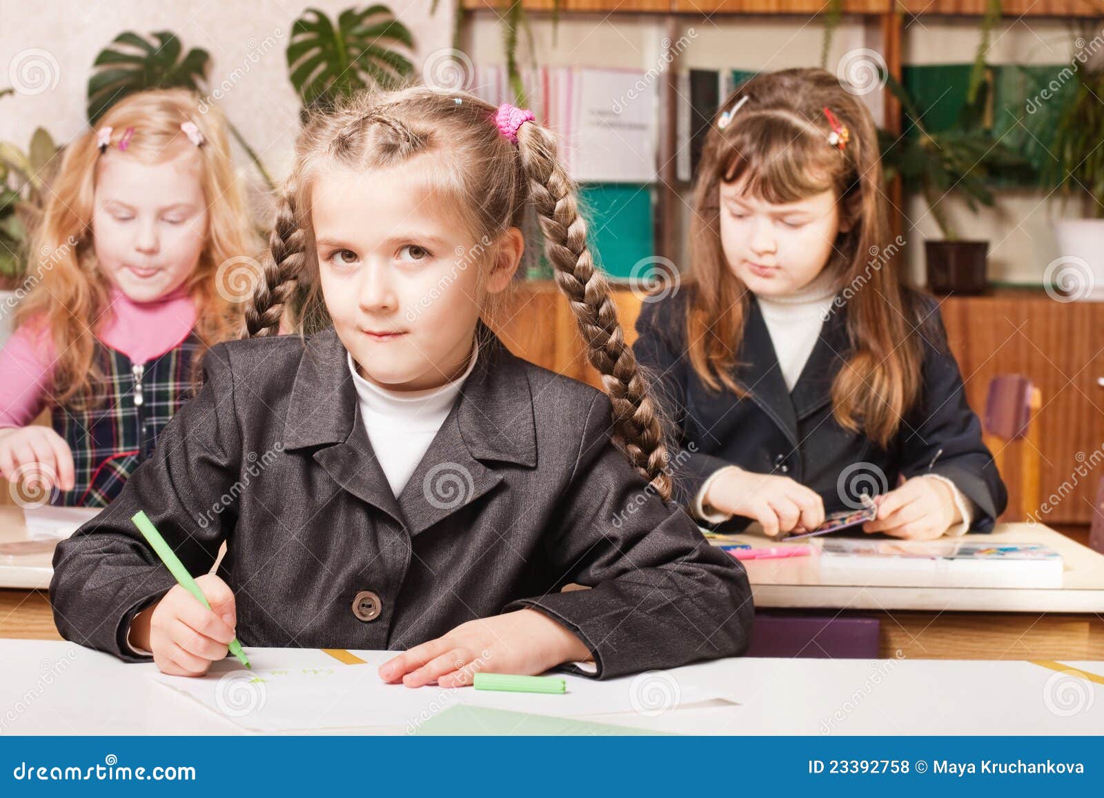 Schoolgirls in classroom stock photo. Image of indoor - 23392758